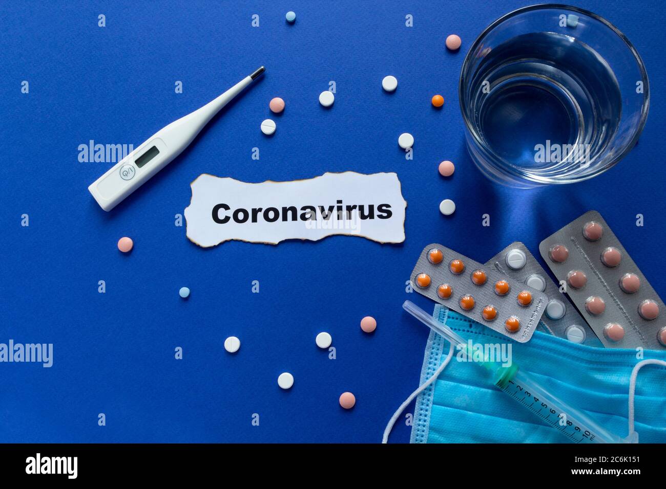 Text CORONAVIRUS with pills, tablets in blister, Thermometer, syringe ...