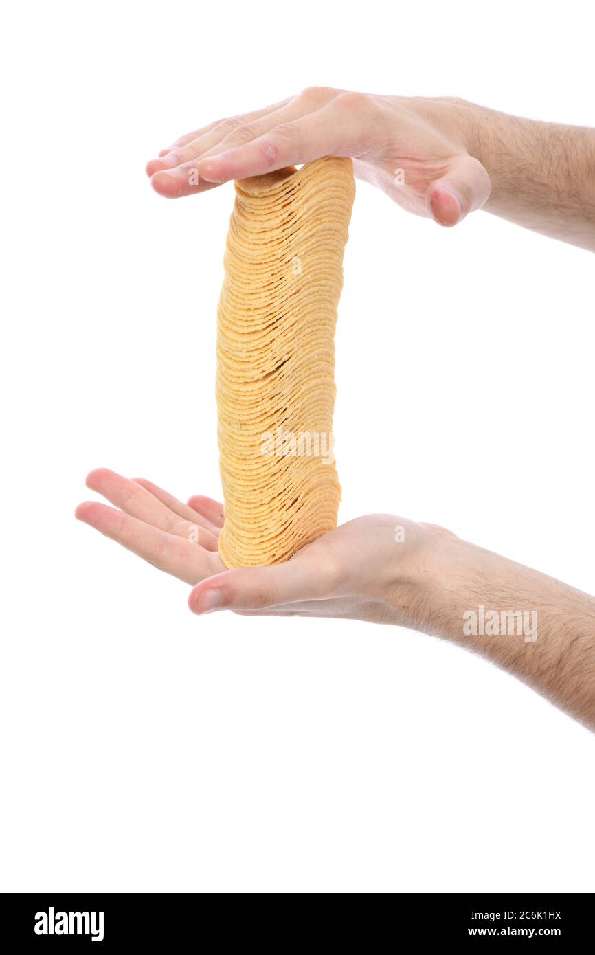 Male hand holding stack of potato chips. Isolated on white background ...