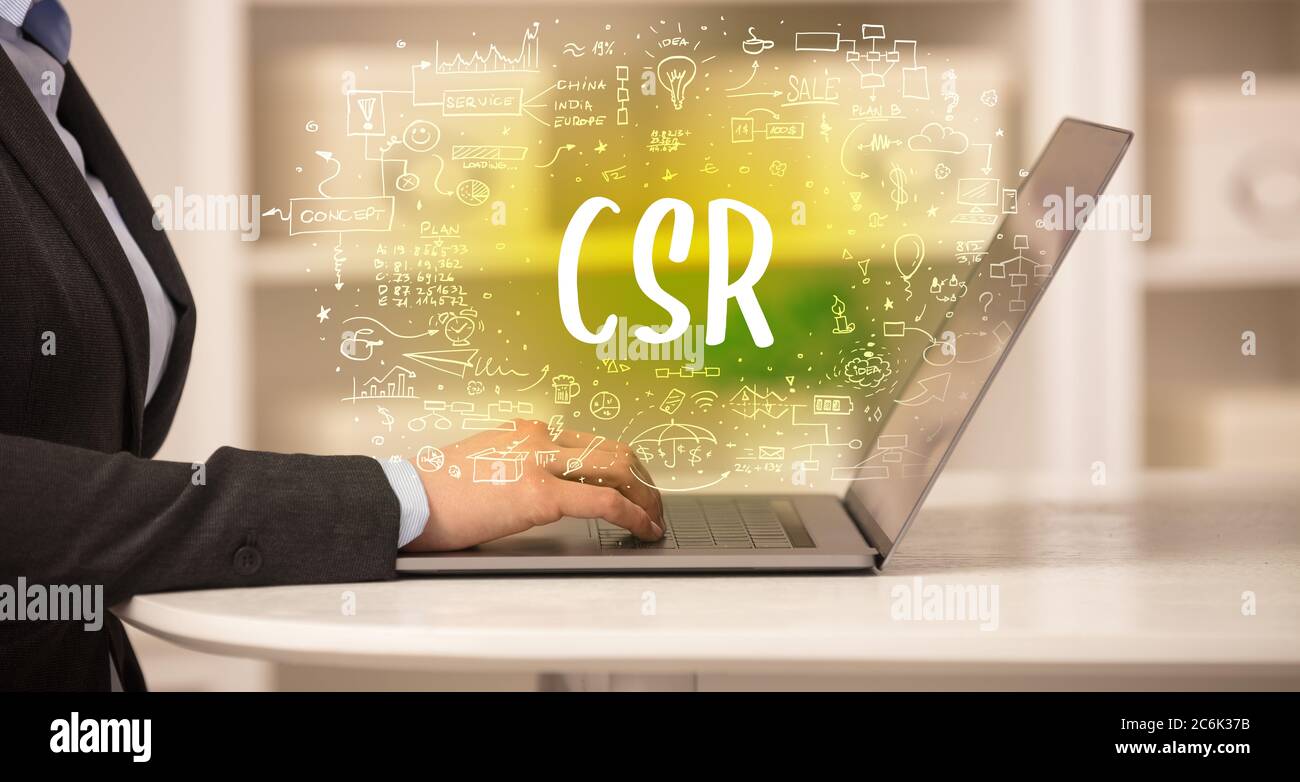 hand working on new modern computer with CSR abbreviation, modern ...