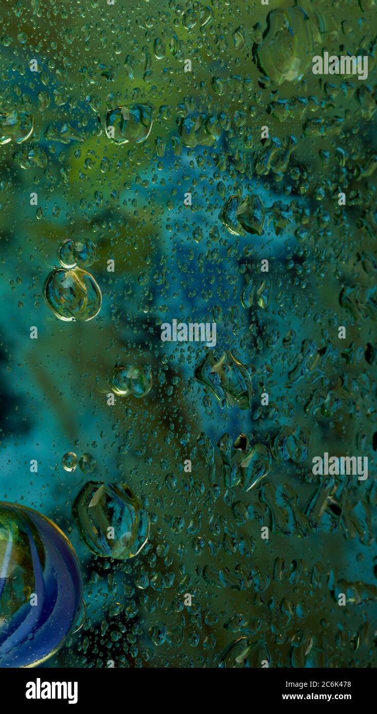 Colour infused water droplets, bubbles, natural environmental portrait ...