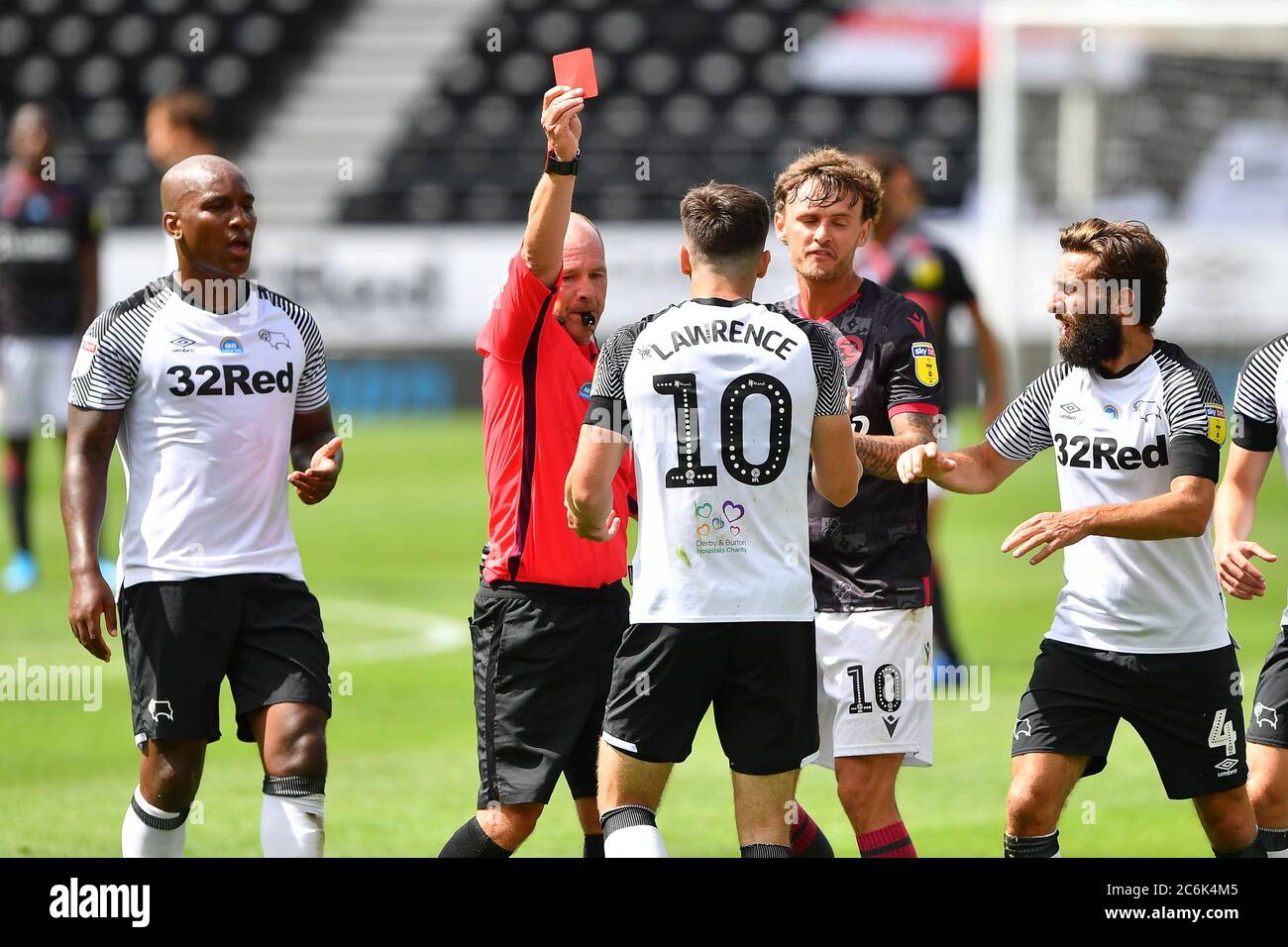 Referee Scott Duncan shows a red card and sends off Tom Lawrence (10 ...