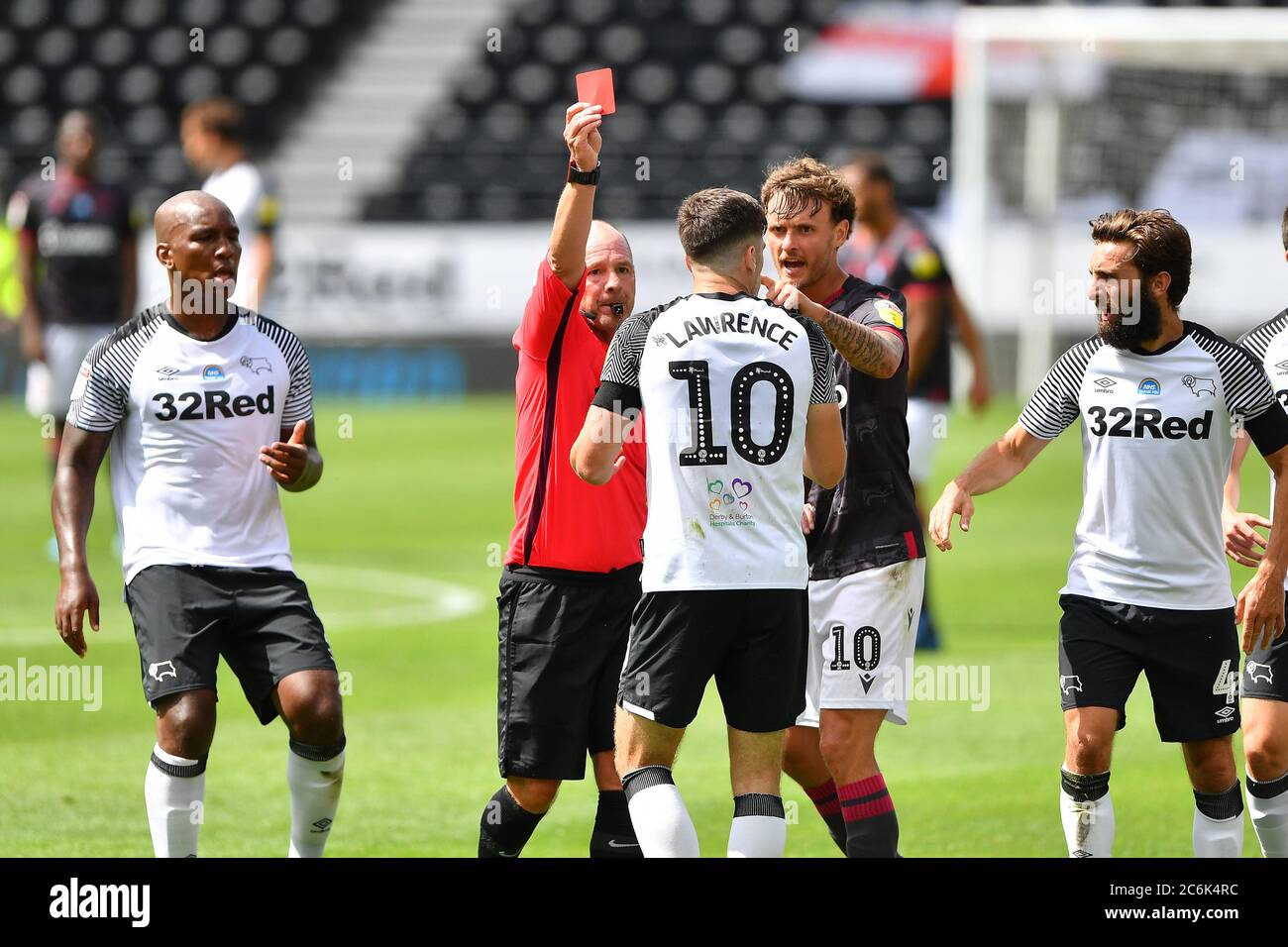 Referee Scott Duncan shows a red card and sends off Tom Lawrence (10 ...