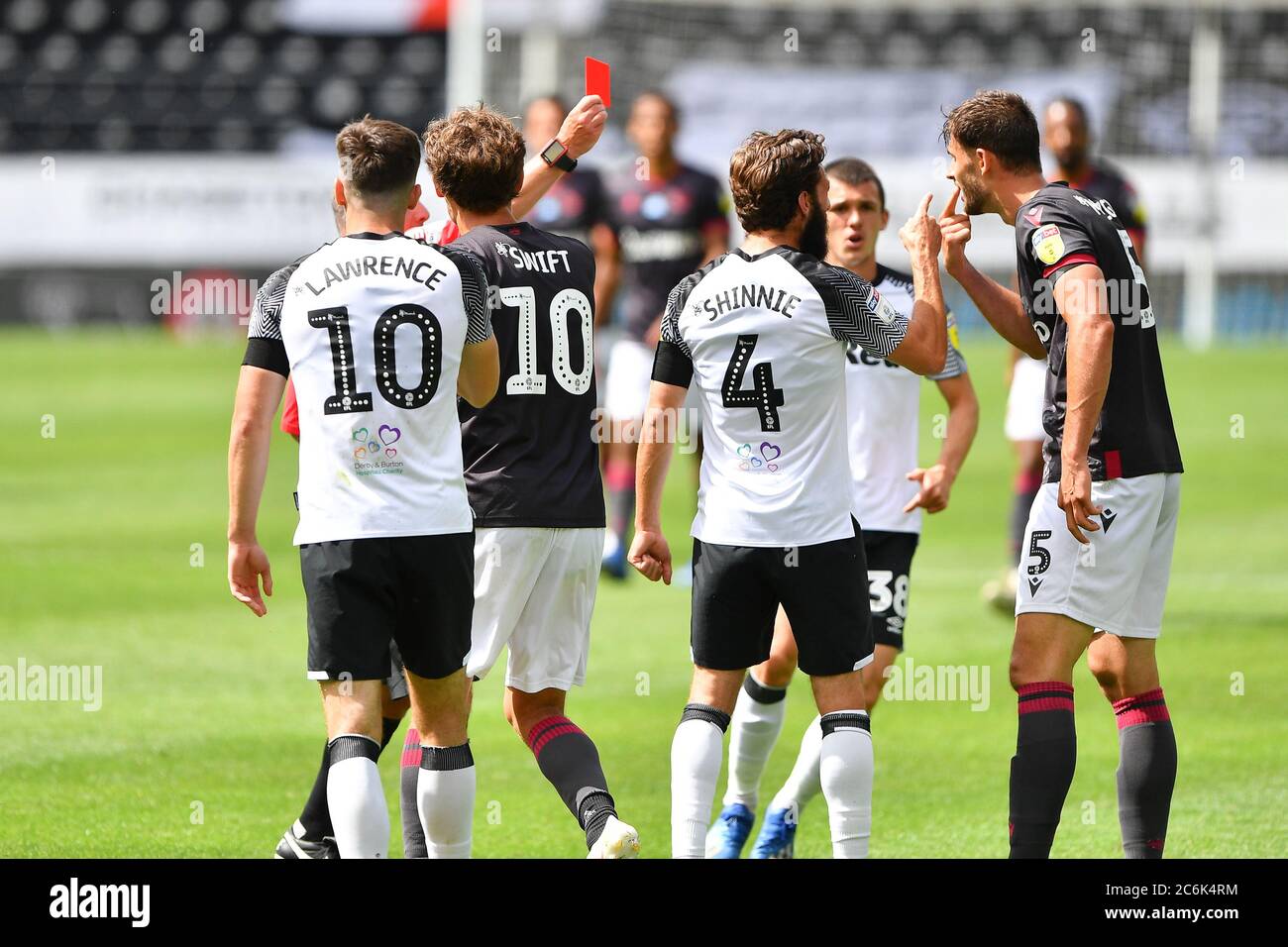 Referee Scott Duncan shows a red card and sends off Tom Lawrence (10 ...