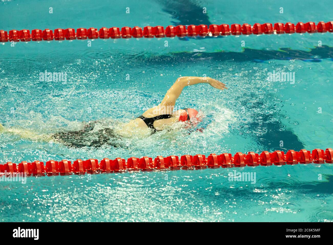 A swimmer performs the freestyle swim stroke during a swimming ...