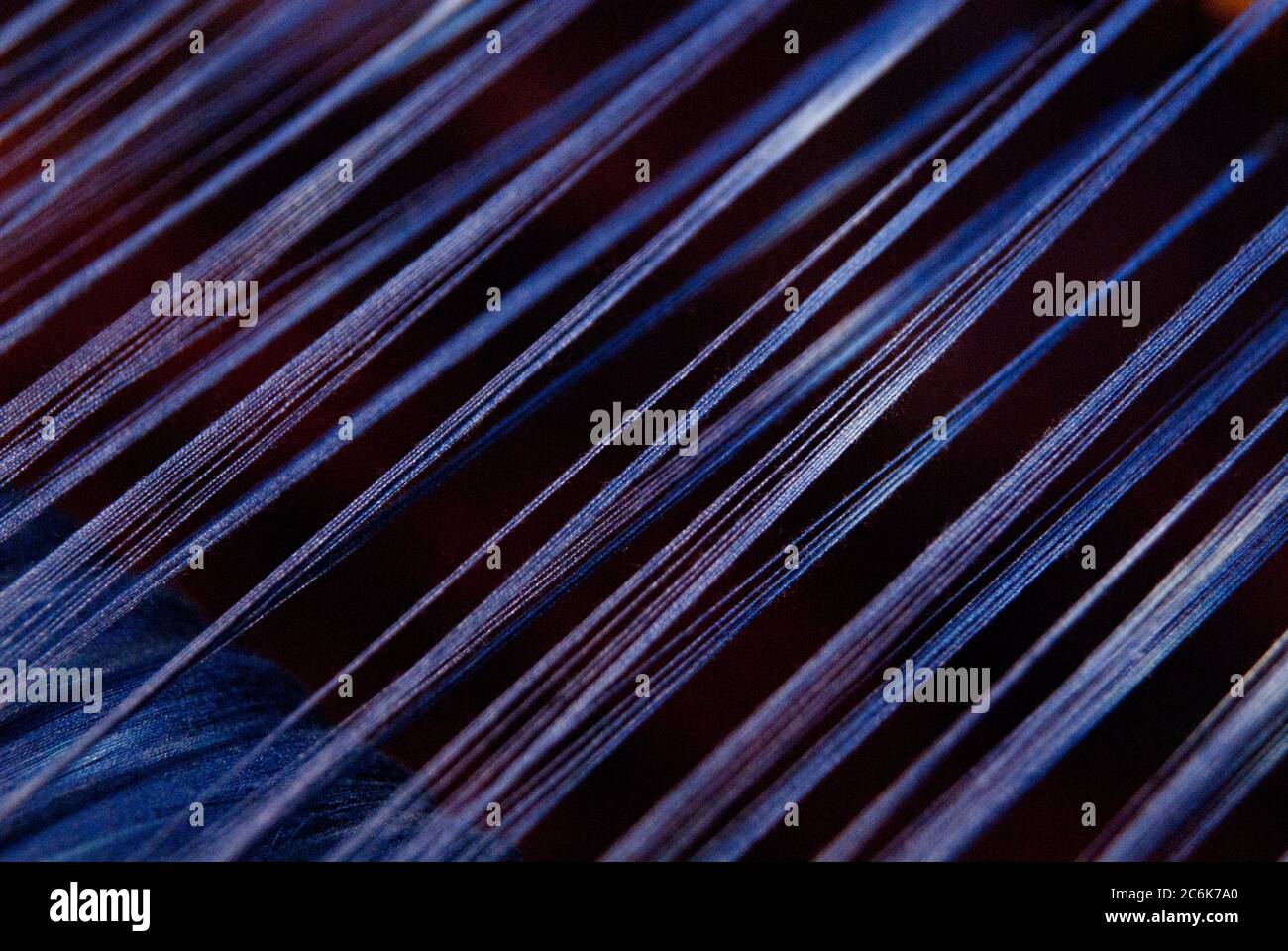 Detail of blue thread being woven at a loom Stock Photo - Alamy