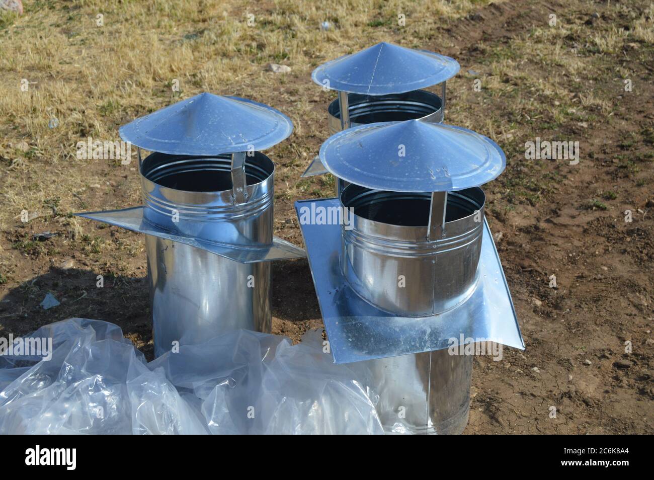 metal objects in village square Stock Photo - Alamy