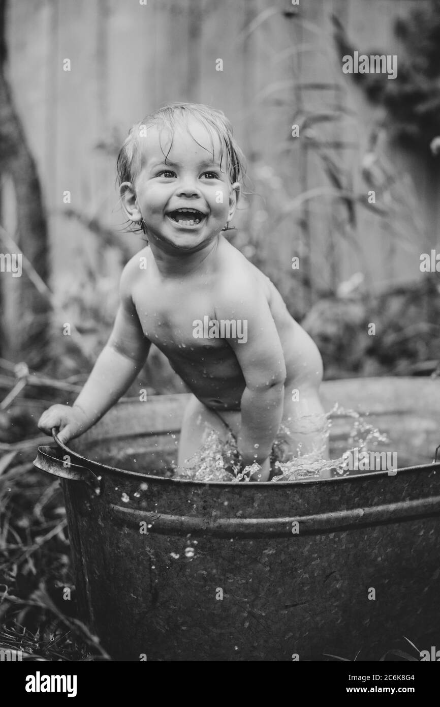 Boy with basin Black and White Stock Photos & Images - Alamy