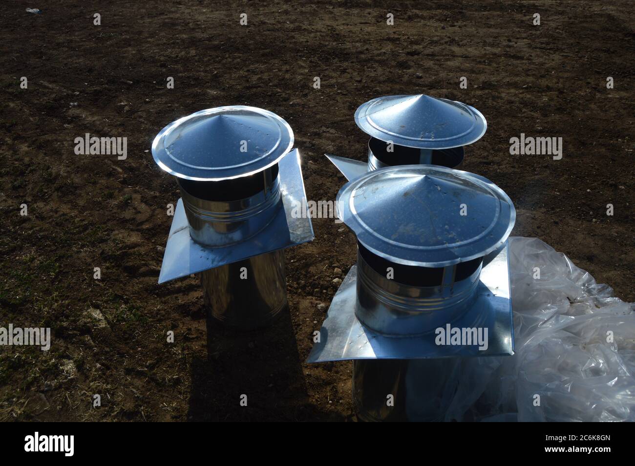 metal objects in village square Stock Photo - Alamy
