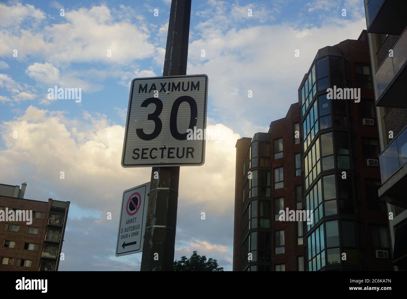 A traffic sign speed limit of 30 Km/hr in a sector with a background of ...