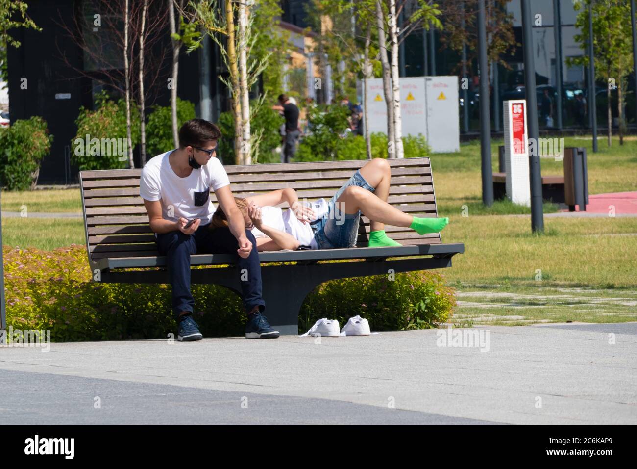 Couple on the bench in the summer Stock Photo - Alamy