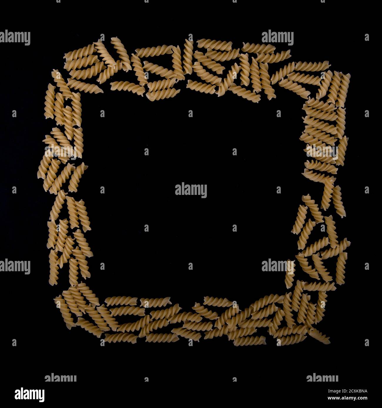 Square shot of pasta screws formed to make a square frame with copy ...
