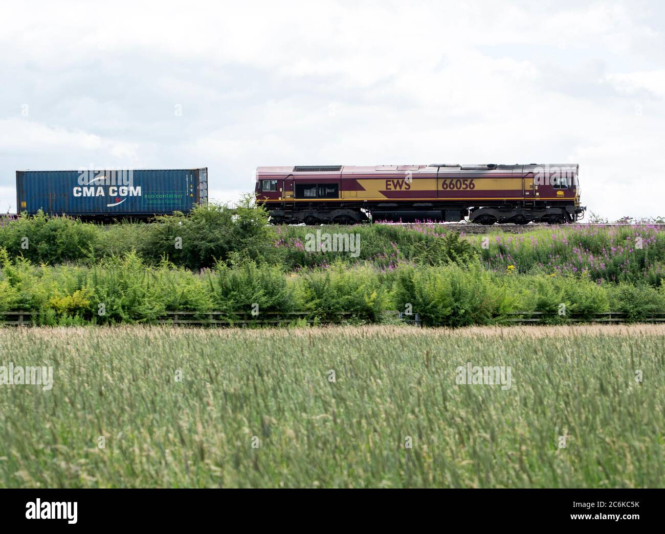 An EWS Class 66 diesel locomotive No. 66056 pulling a freightliner ...