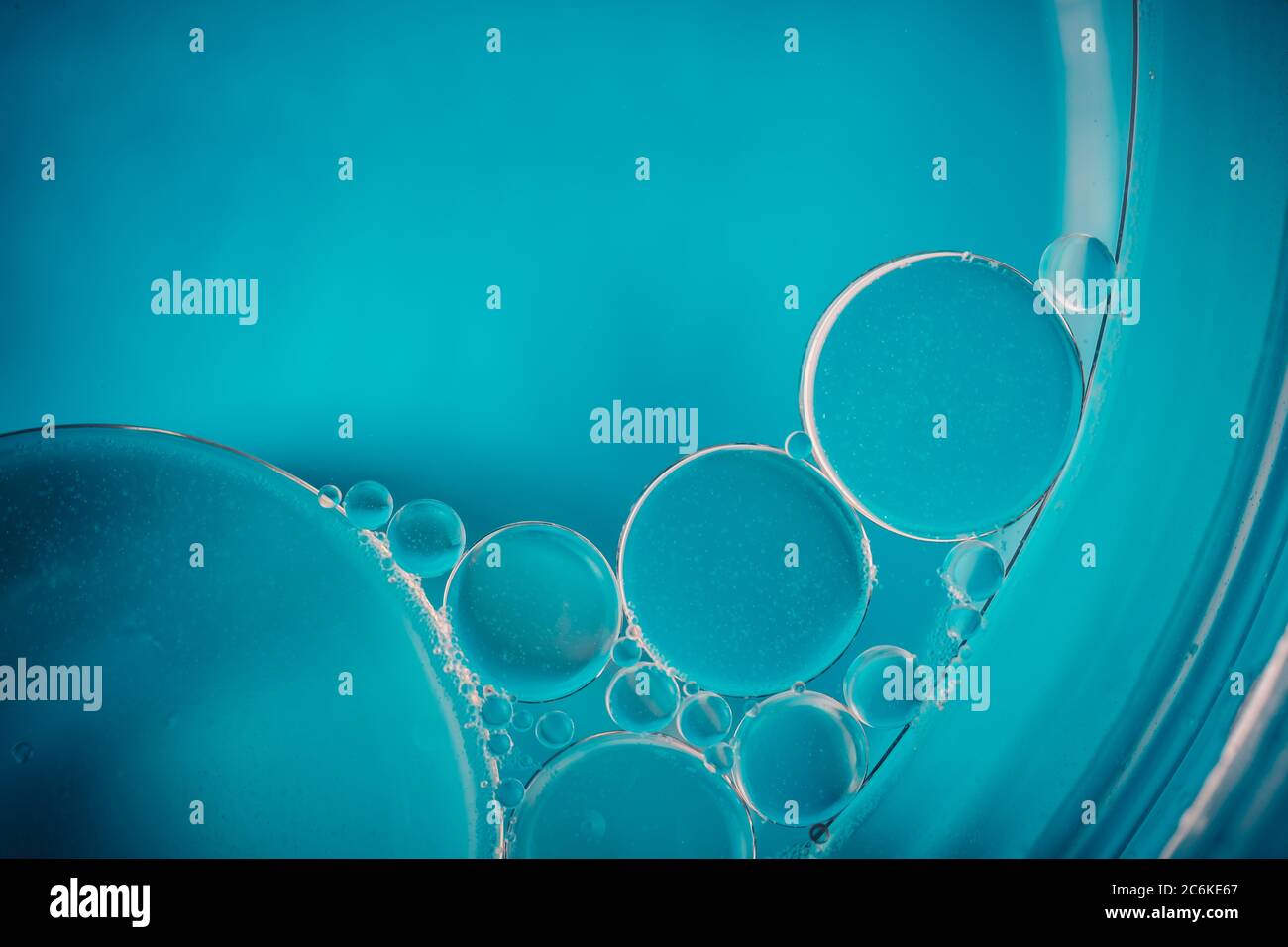 Oil drops on the water - Abstract background blue macro photography ...