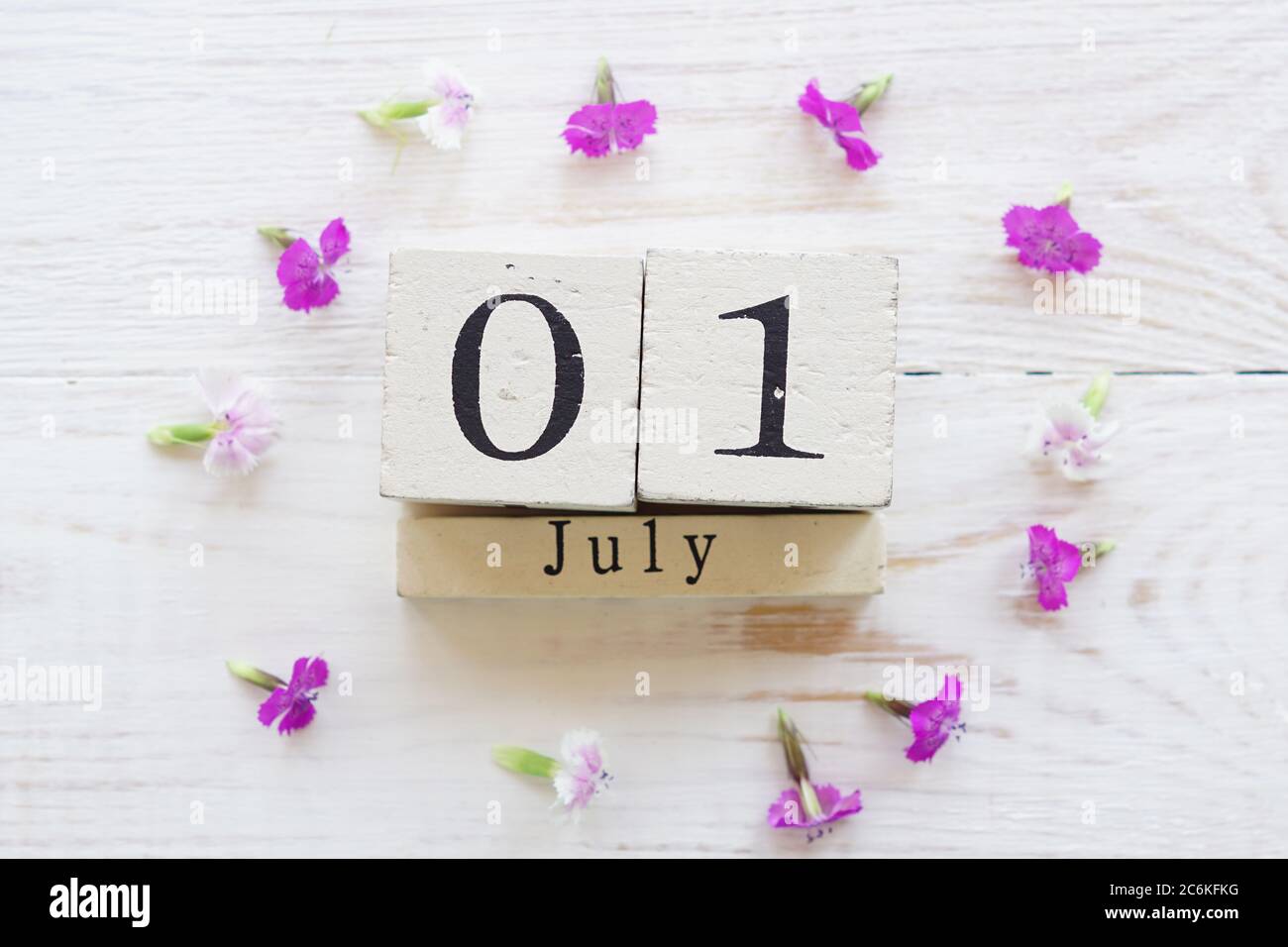 first day of July, colorful background with calendar and pink flowers ...