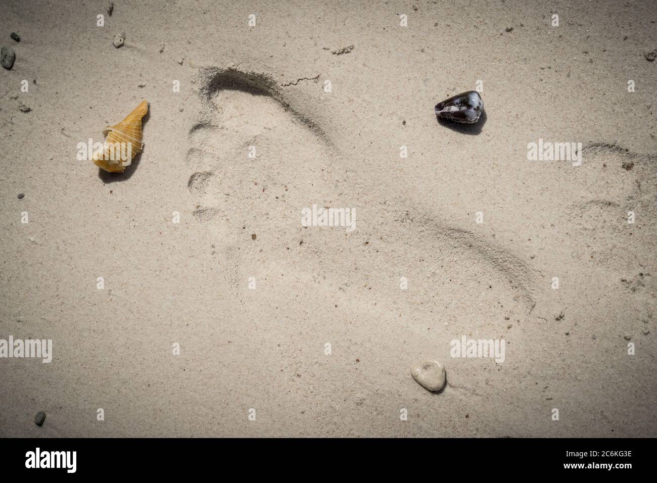 Footprints in sand. Close up of footprints on the sand beach with ...