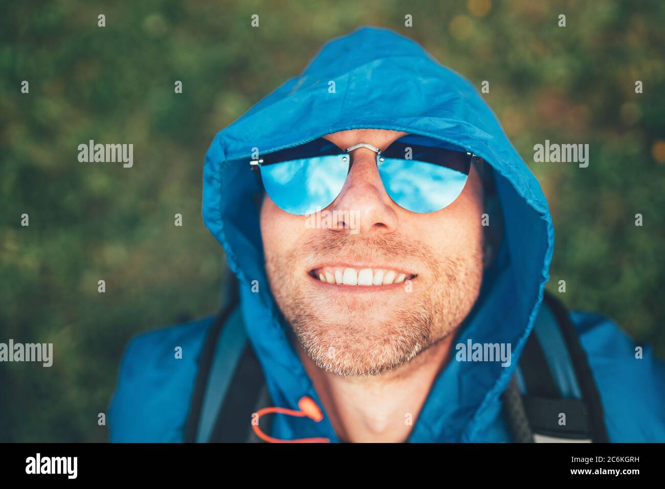 Backpacker man has a rest break enjoying mountain walking break,he ...