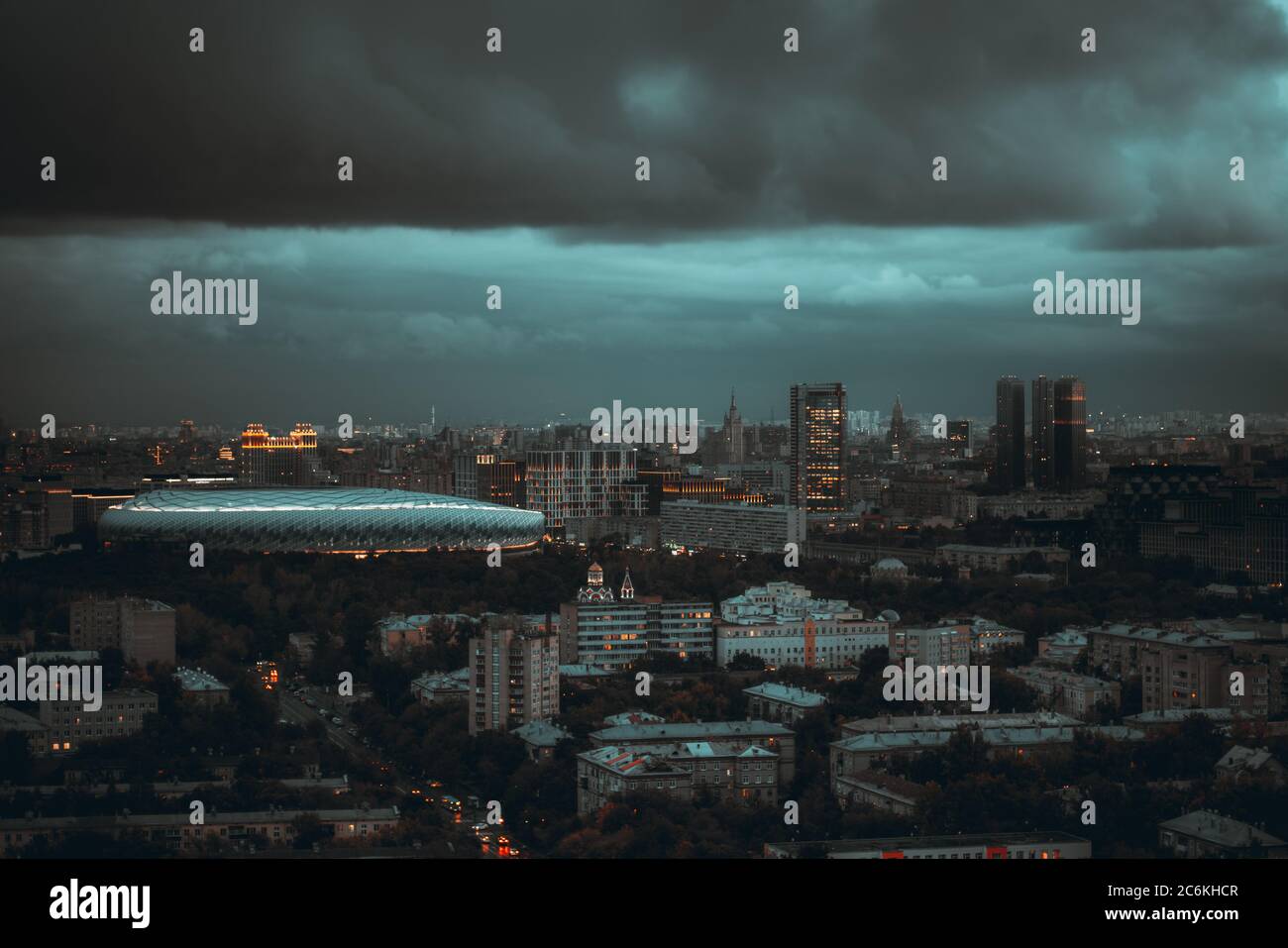 Dark evening stormy cityscape: aerial view from a drone of a night ...