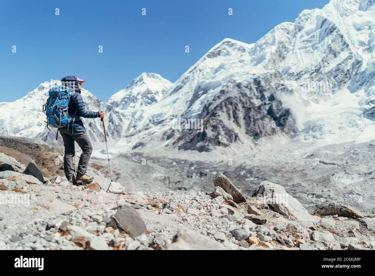 Young hiker backpacker female taking brake in hike walking enjoying ...