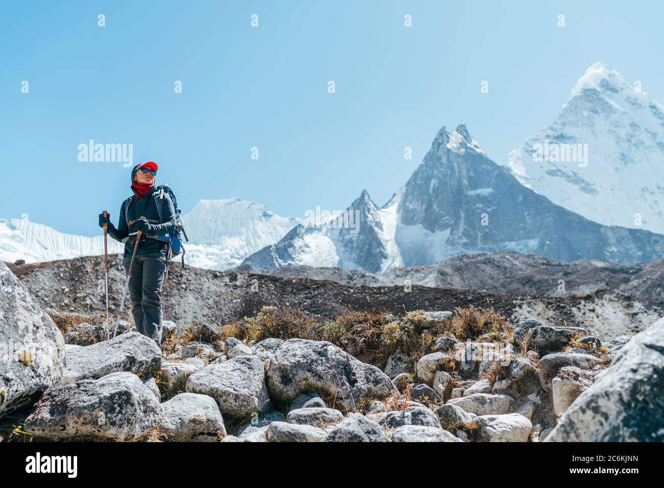Young hiker backpacker female taking brake in hike walking enjoying ...