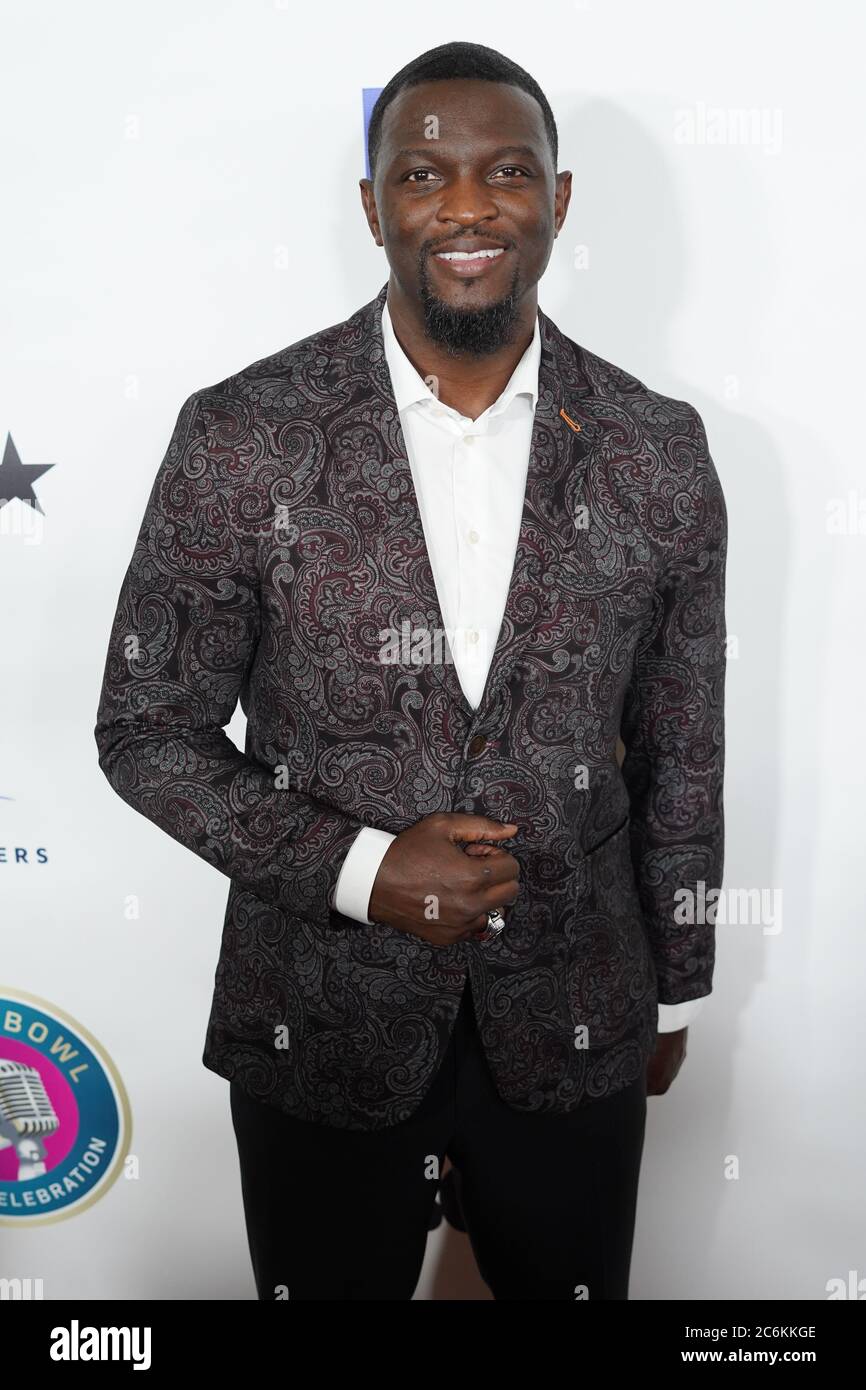 Former NFL Player Walt Harris pose for pictures during the 21st Annual ...