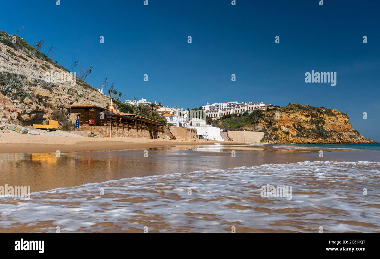 Beach in the fishing village of Burgau in the Algarve, Portugal Stock ...