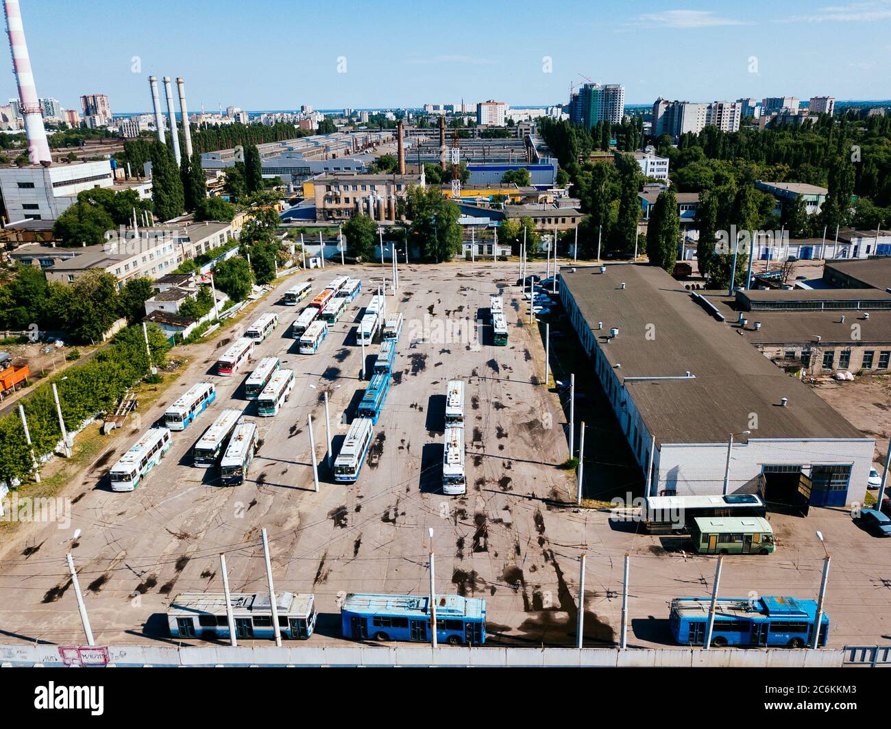 Trolleybuses in the parking lot at depot, aerial view Stock Photo - Alamy