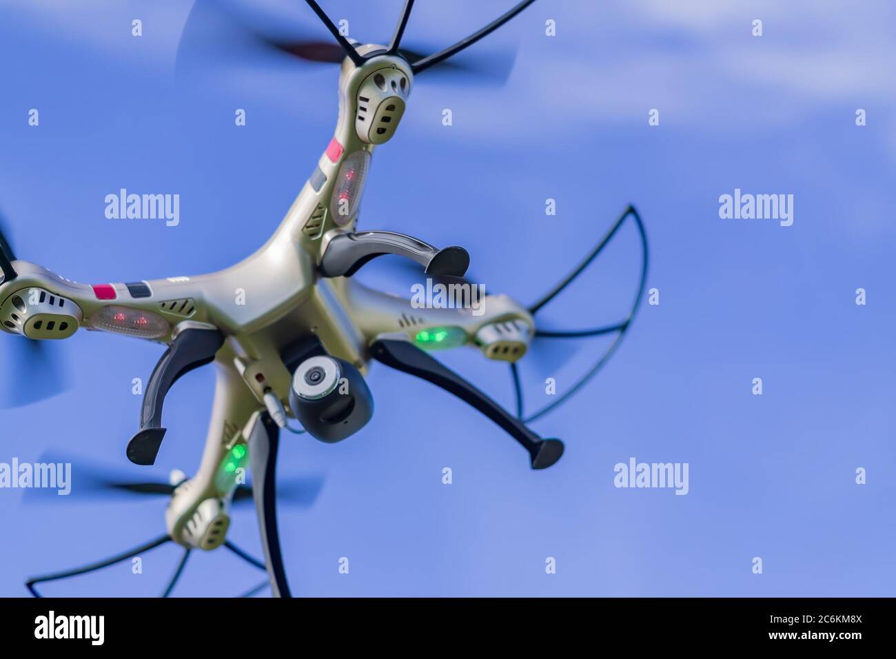flying drone with remote control against blue sky background Stock ...