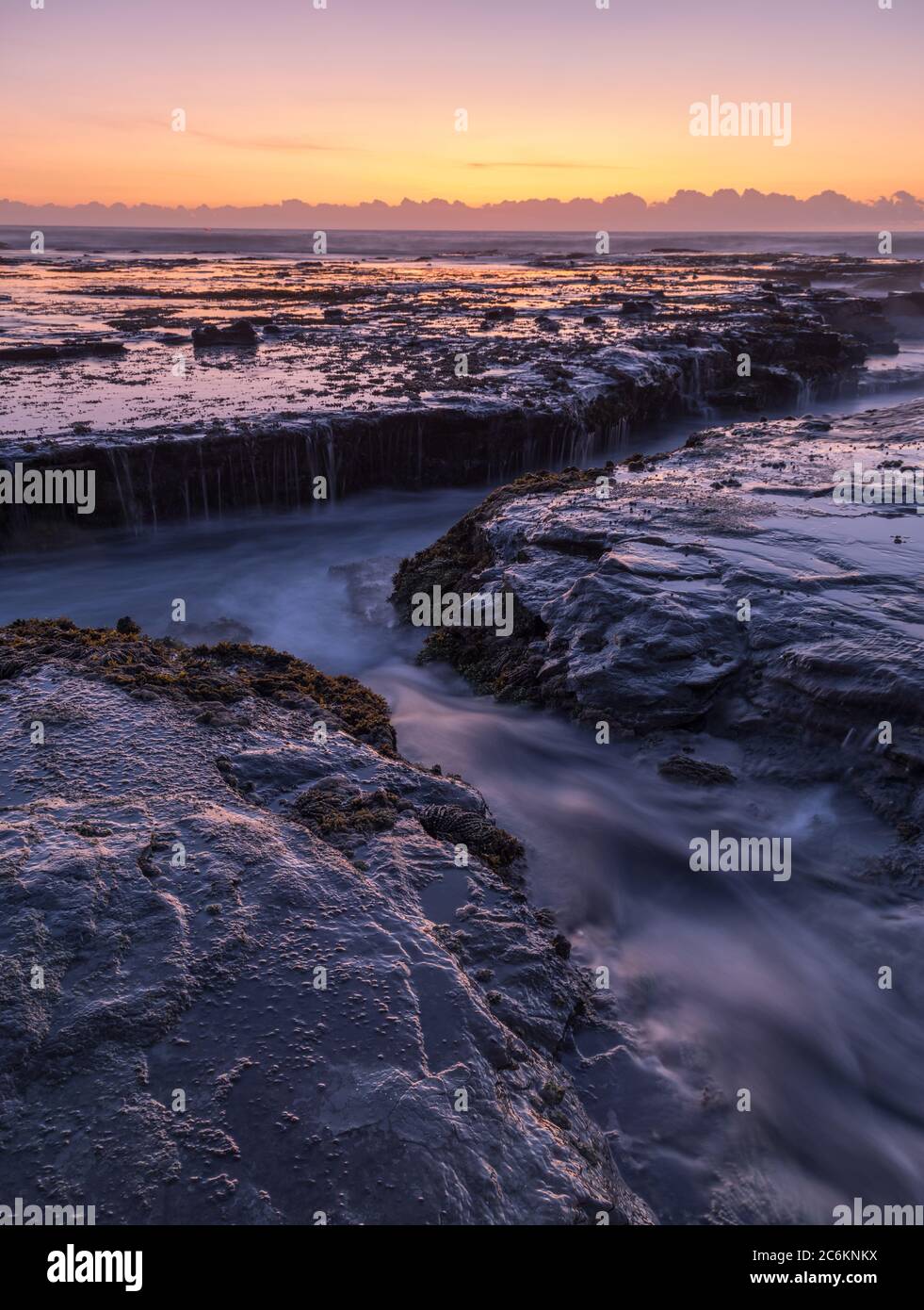 Sunrise across rock platform at the Cowrie Hole - Newcastle NSW ...