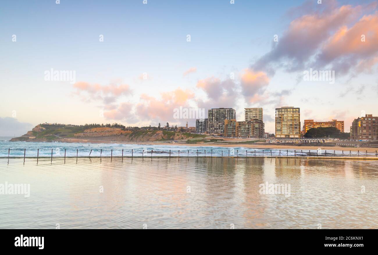 Morning seascape at the "Canoe Pool" at Newcastle beach is a famous landmark in the beachside ...