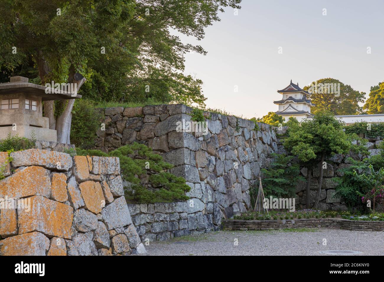 Ancient stones splashed with color along wall of historic Japanese ...