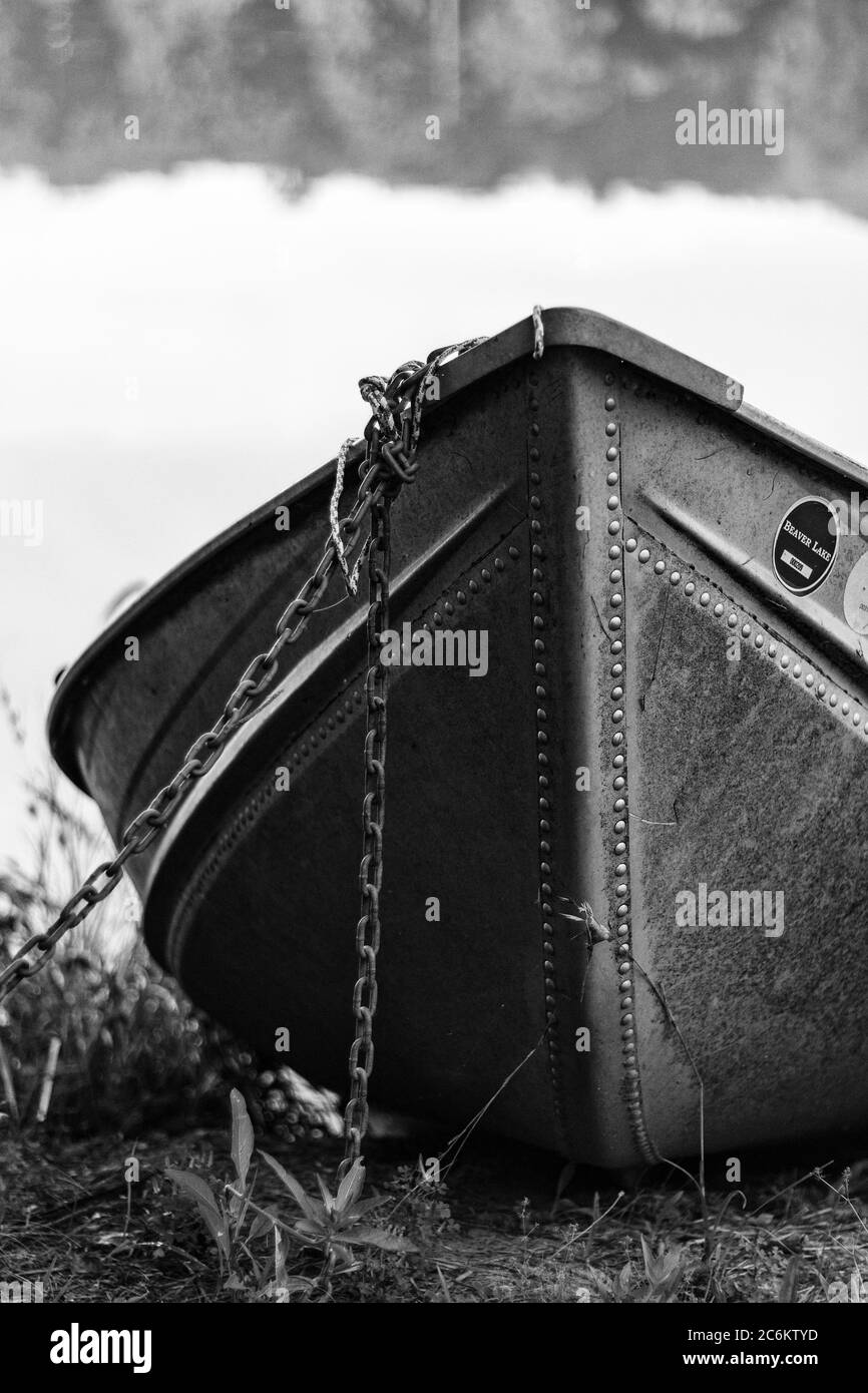 Resting on the lake's shore, this shot of a rowboat reveals itscurved ...