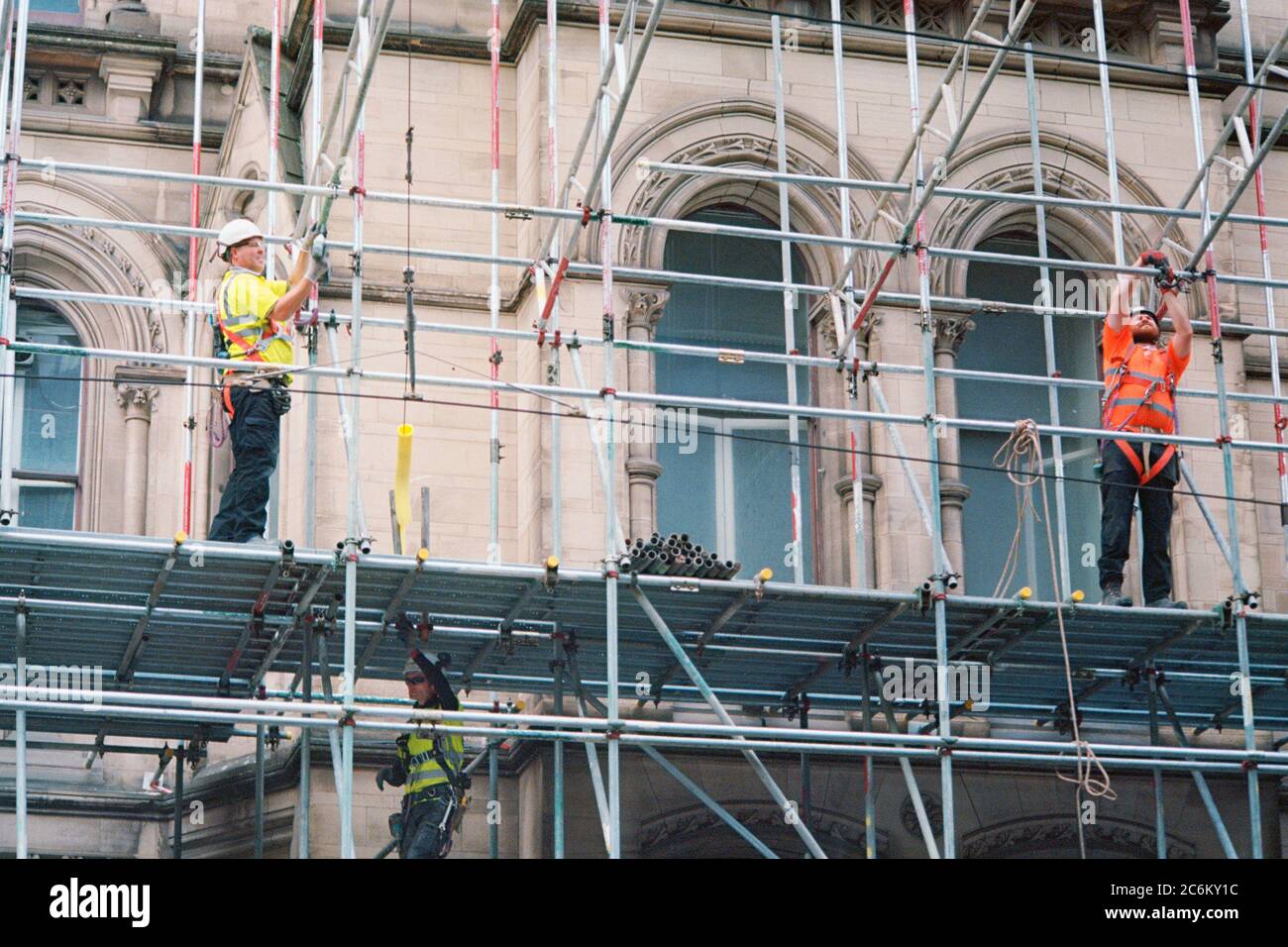 Manchester, UK - 5 July 2020: Workers are building scaffolding for ...
