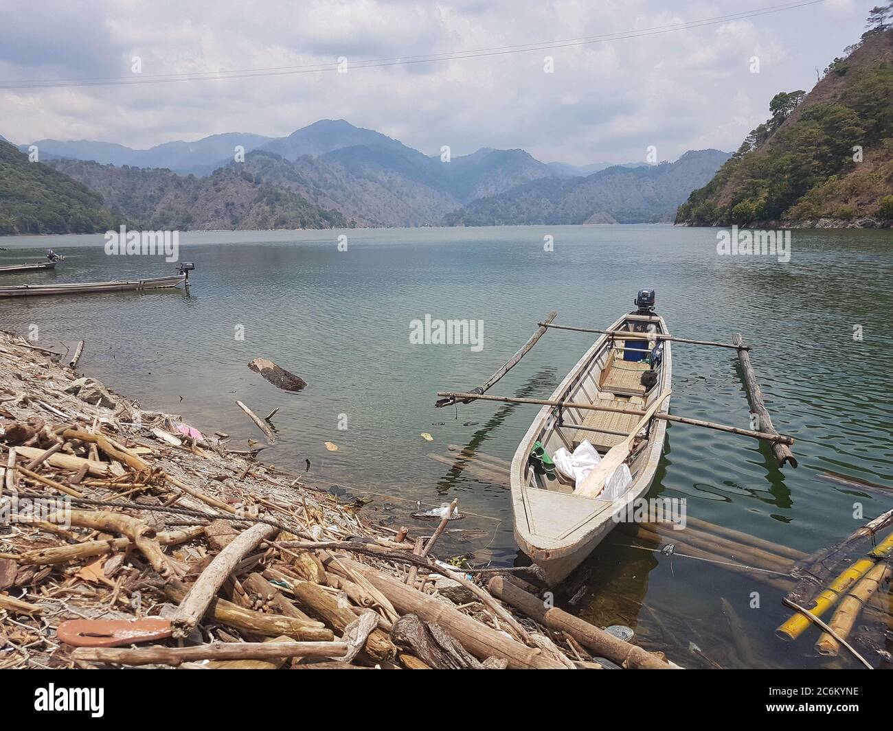 Fishing boat docked at a dam reservoir Stock Photo - Alamy