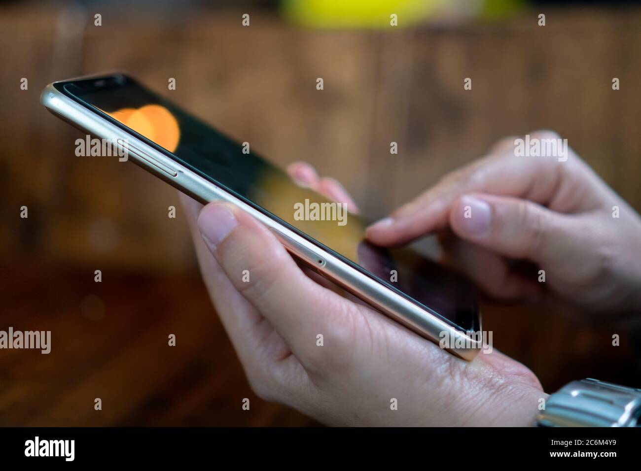 Woman hand using smartphone in cafe shop background. Business ...