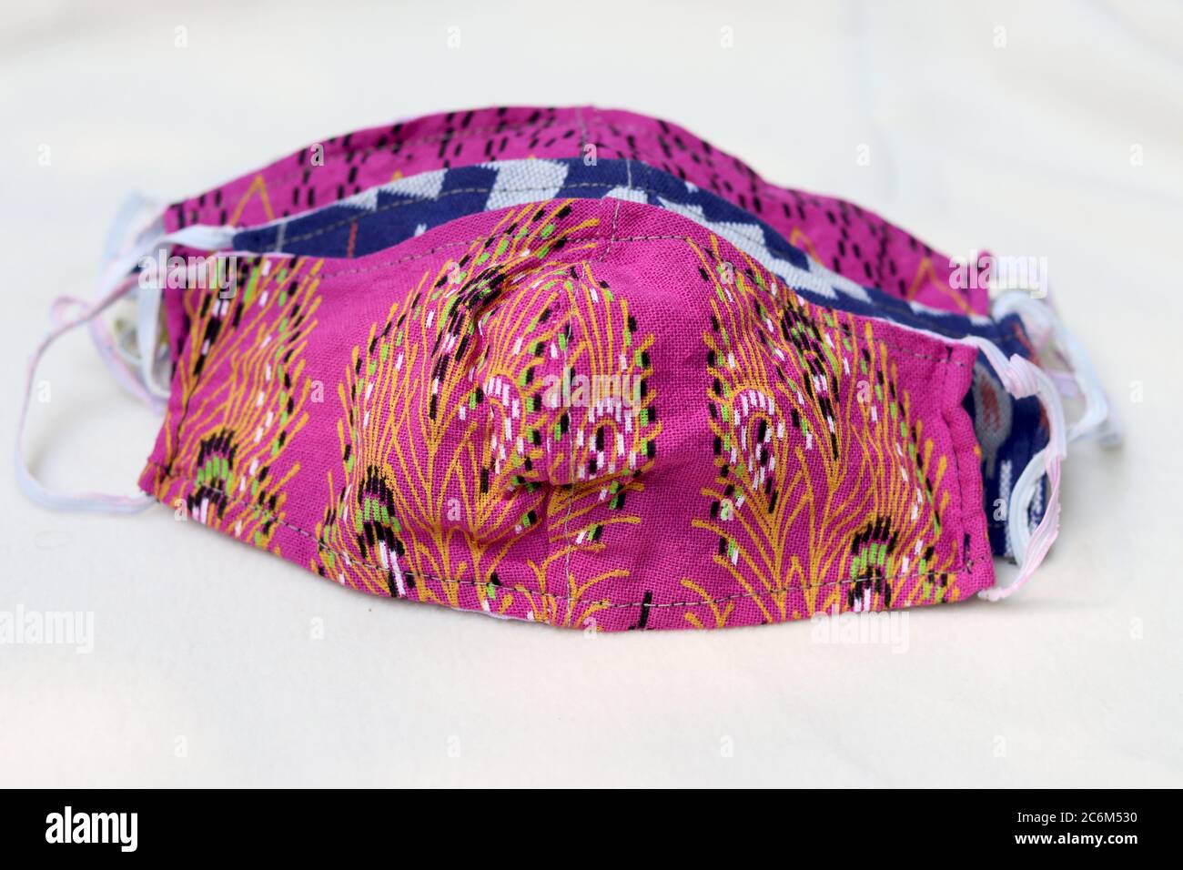 Colorful DIY fabric masks on white background. Concept for protect from ...