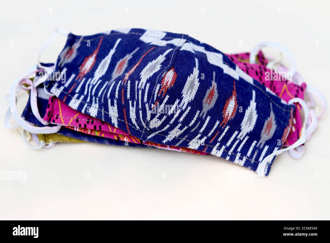 Colorful DIY fabric masks on white background. Concept for protect from ...