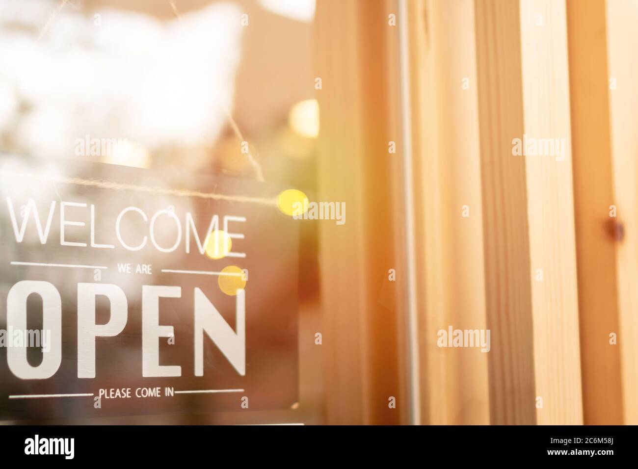 Open sign vintage style at coffee cafe shop with sunrise and bokeh ...