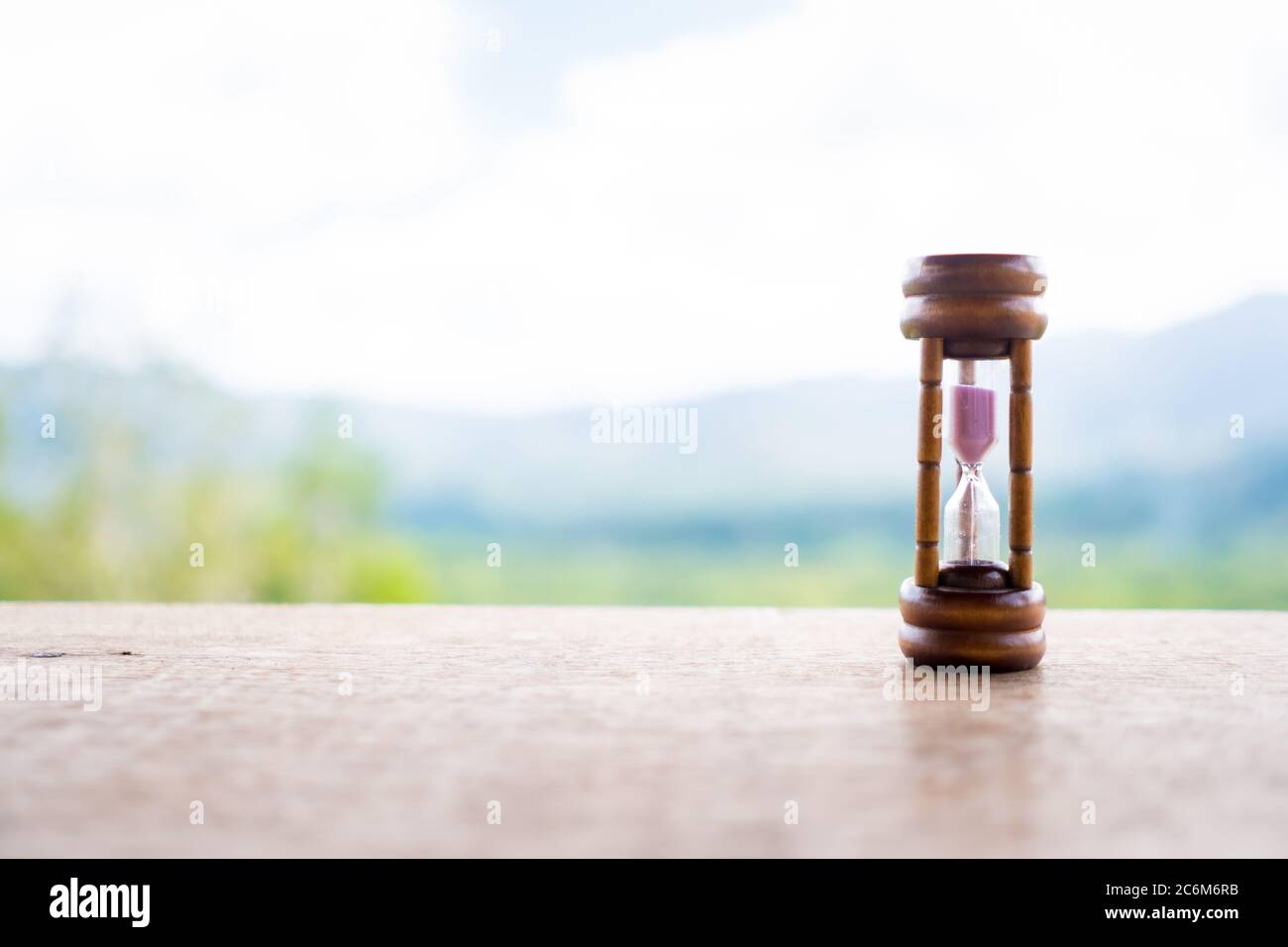Small vintage hourglass show time is flowing never return with nature ...