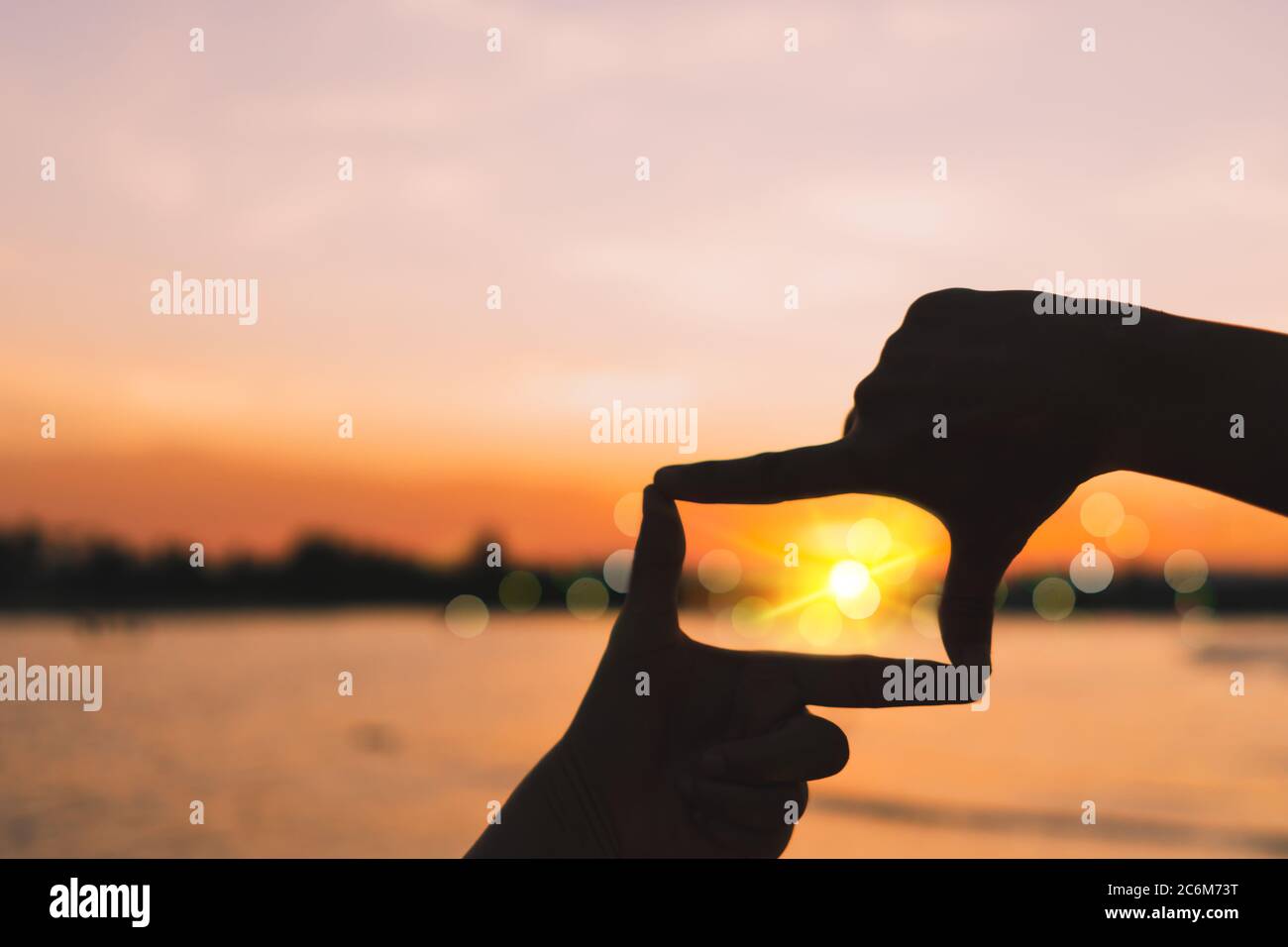 Human hand taking photo of sunrise hi-res stock photography and images ...