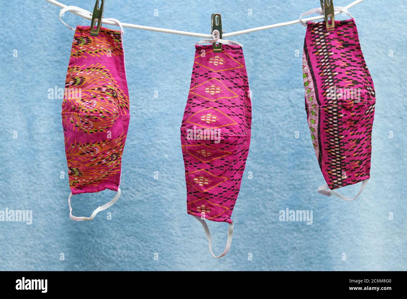 DIY cloth face masks washing and hanging on the clothes line after ...