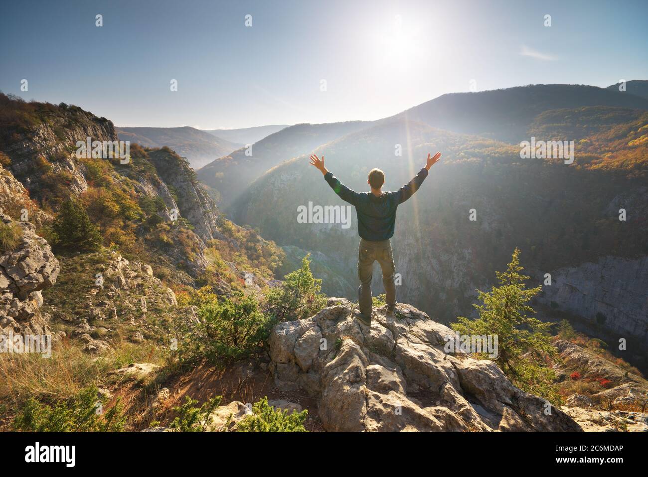 Man standing on the cliff. Conceptual scene. Mountain nature ...