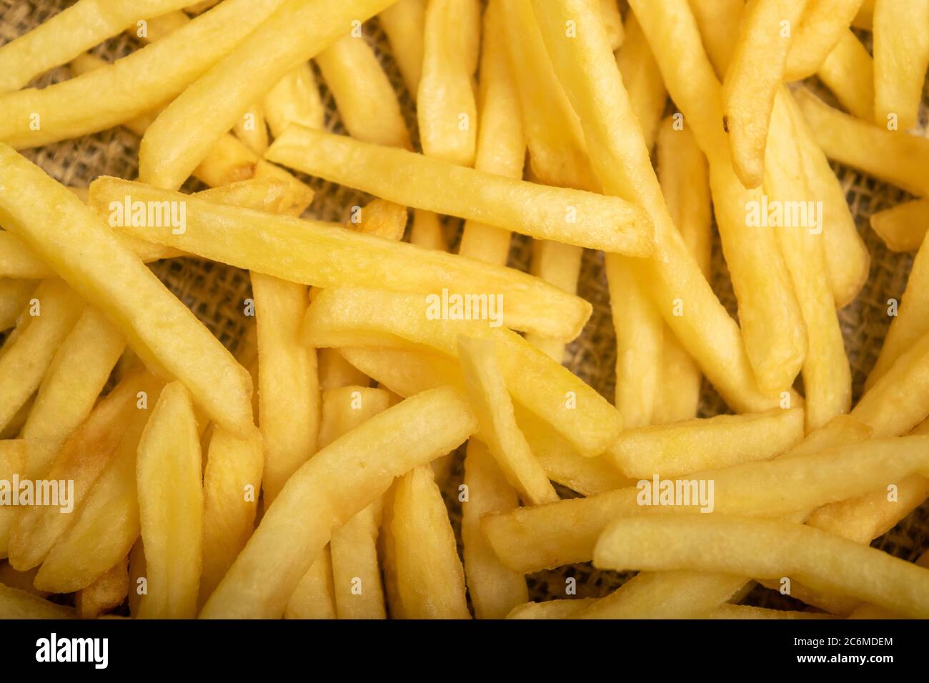 French fries scattered surface texture. Close up Stock Photo - Alamy