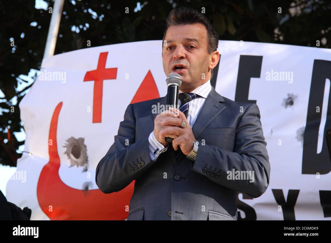 Samir Yousif speaks at the rally in Belmore Park, Sydney against the ...