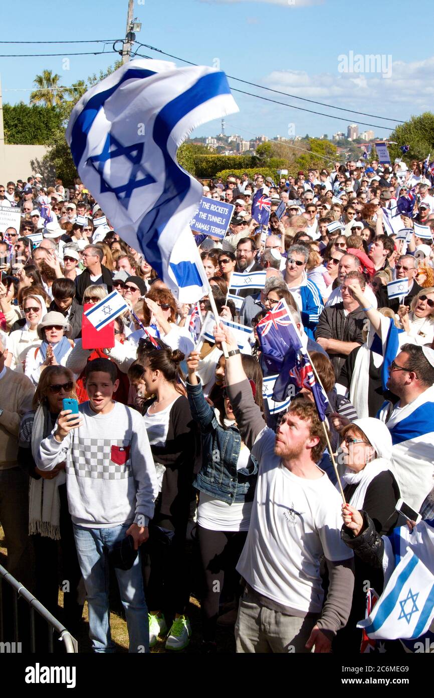The Israeli flag is waved at the rally in support of Israel’s right to ...