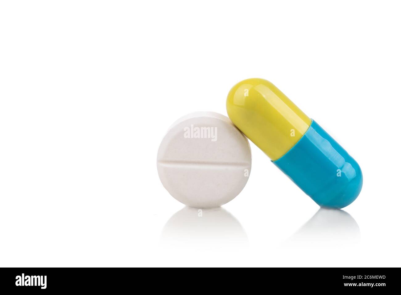 Close-up on medicine drug in capsule and tablet format on white ...