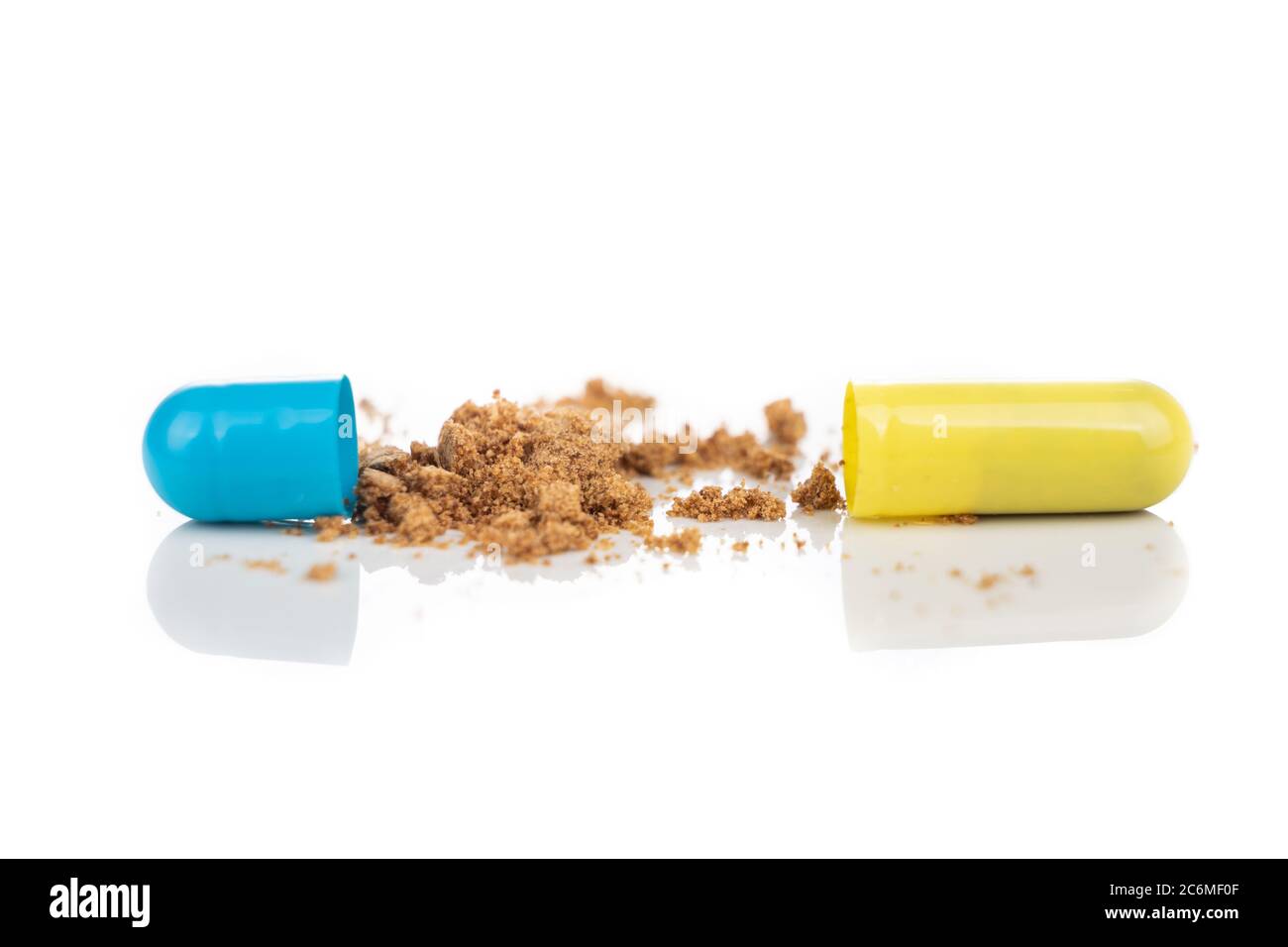 Close-up of opened medicine capsule revealing powder active drugs ...