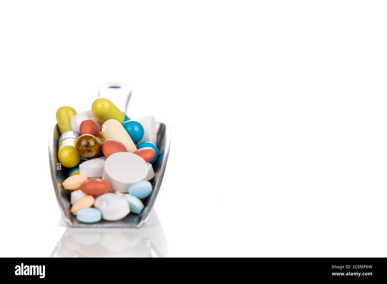 Healthcare concept of ladle with scoop of various medicine tablet ...