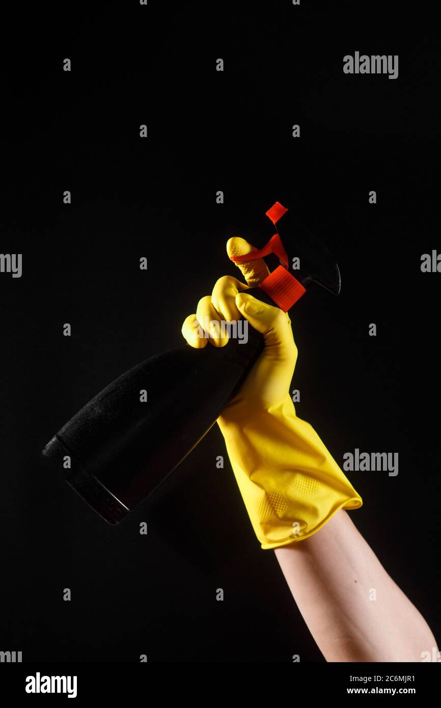 cleaning products, black wiper in hands with yellow rubber gloves Stock ...