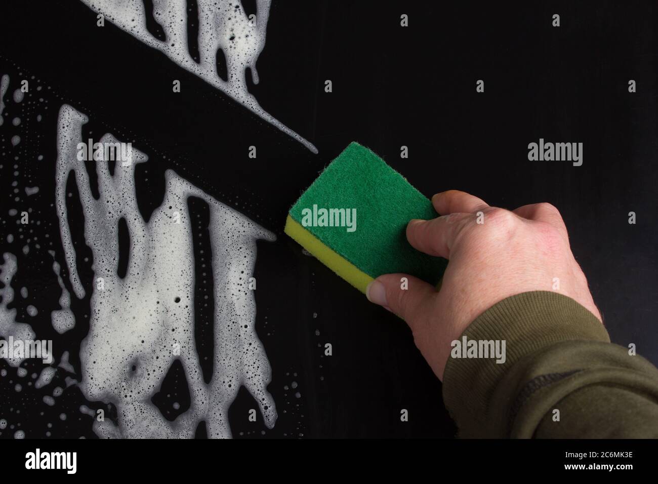The texture of the soap foam stains marks on a black background. The ...