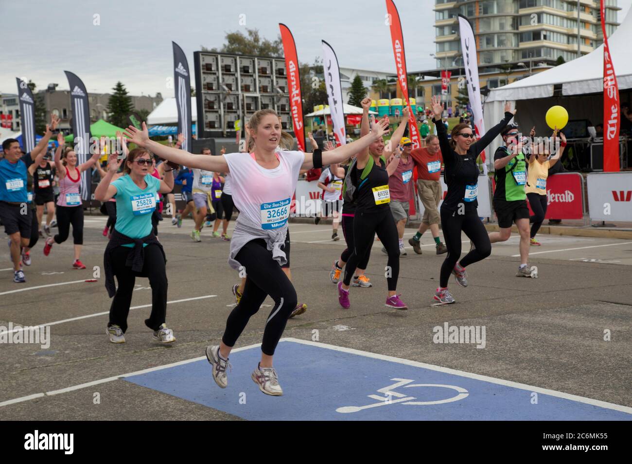 2014 City2Surf runners as they approach the finish line at Bondi Beach ...